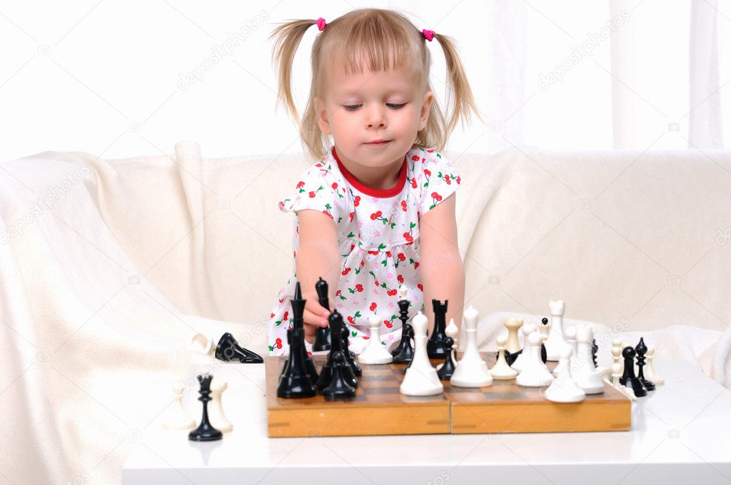 Little girl playing chess — Stock Photo © SergeyNivens #4173579