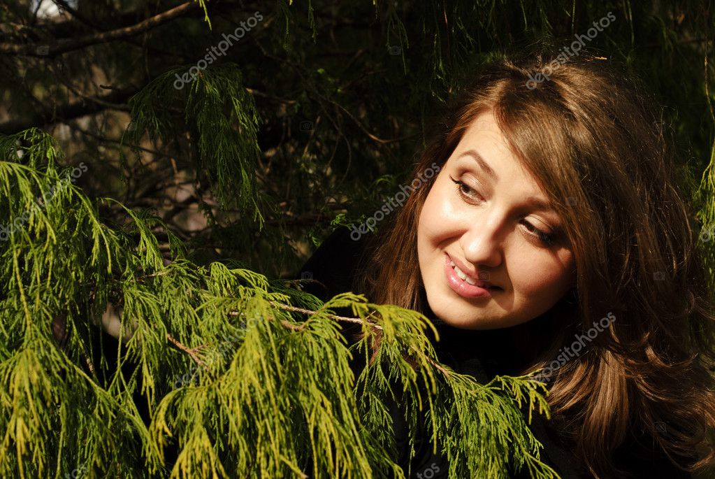 Girl behind the tree Stock Photo by ©oksixx 2855999