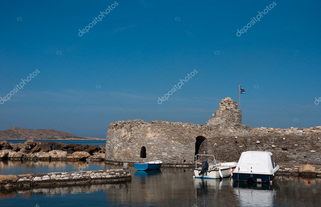 Greek ruined castle on the sea, boats — Stock Photo © Asteri #2891948