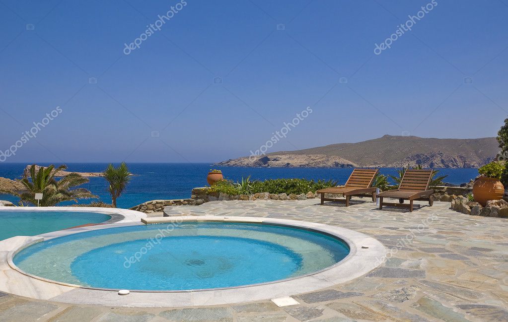 A round pool with deck chairs ⬇ Stock Photo, Image by © Asteri #3118134