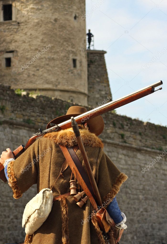 Musketeer against the backdrop of the castle Stock Photo by ©maxxyustas ...