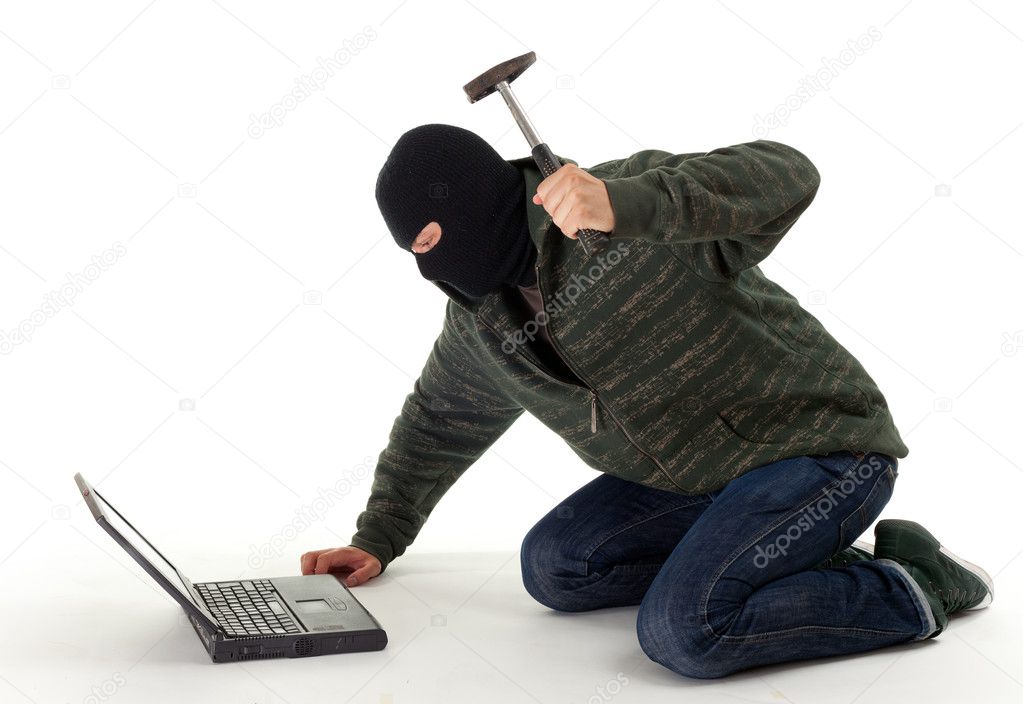 Angry criminal with hammer and laptop — Stock Photo © photomak #3406399
