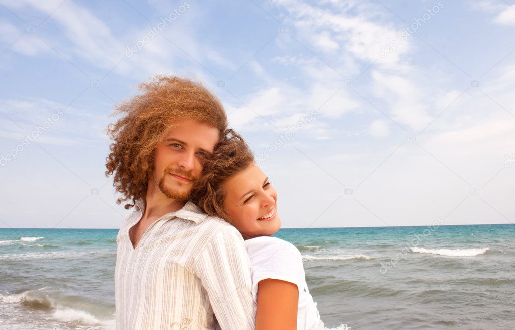 Beautiful couple by the sea Stock Photo by ©luckybusiness 2833011
