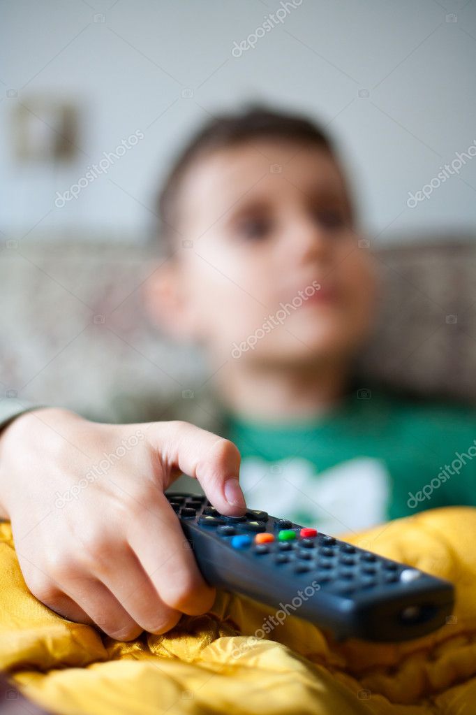 Holding tv remote control Stock Photo by ©Xalanx 3443728