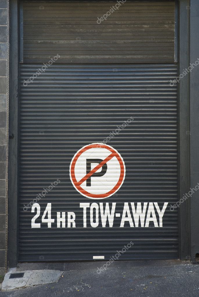 Roller door with sign Stock Photo by ©Heinschlebusch 2776203