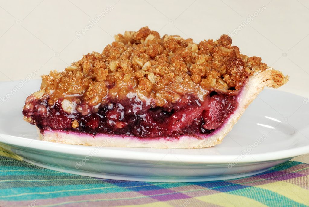 Side view mixed fruit crumble pie Stock Photo by ©mcgphoto 3859872