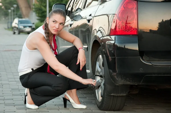 Change wheel woman Stock Photos, Royalty Free Change wheel woman Images ...