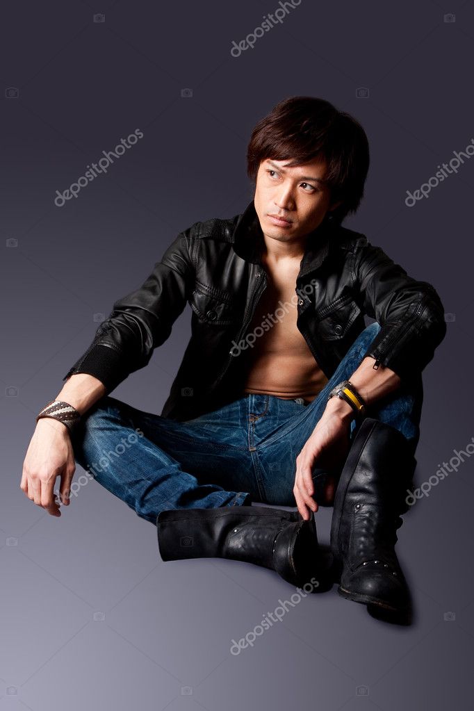 Handsome Asian man with leather jacket — Stock Photo © phakimata #2764924