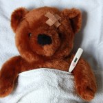 Sick teddy with injury in bed Stock Photo by ©gunnar3000 3357681