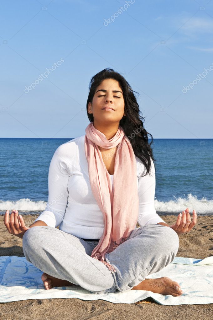 Young native american woman meditating — Stock Photo © elenathewise ...