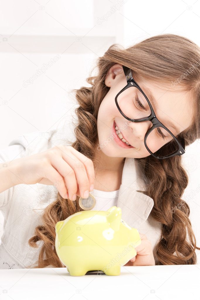 Little girl with piggy bank and coin — Stock Photo © Syda_Productions ...