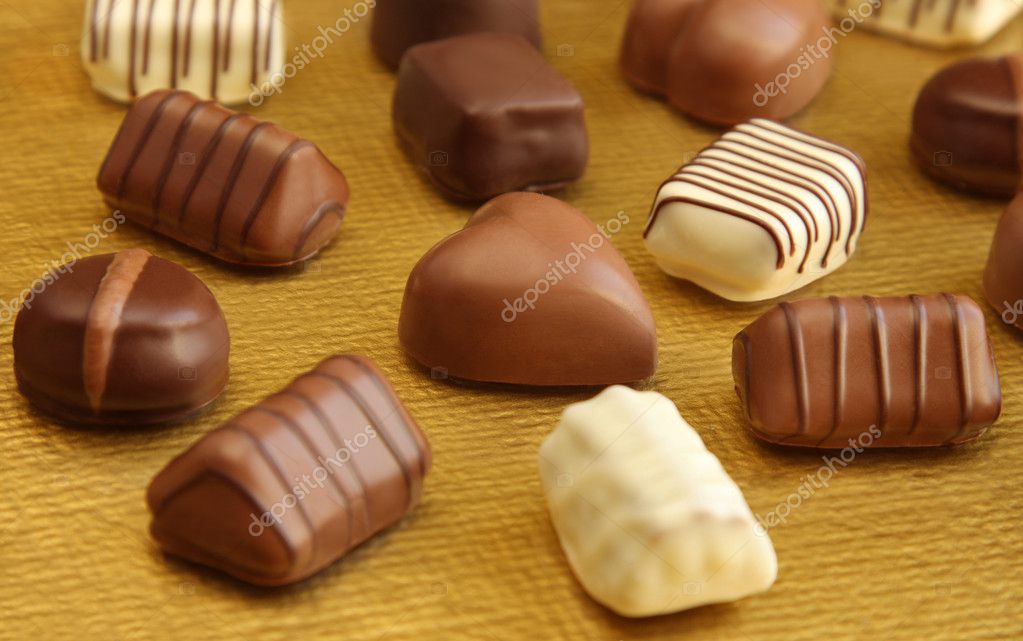 Luxury chocolates on golden plate — Stock Photo © Borna_mir #3795877