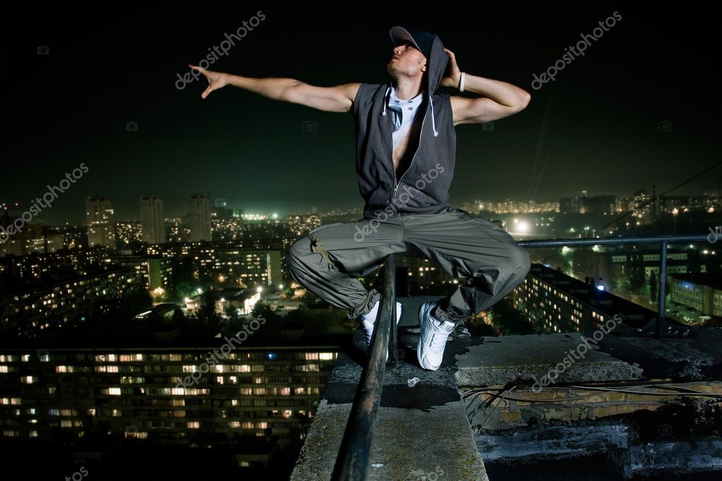 Extreme dance on the brink of a roof — Stock Photo © slinky #3442389
