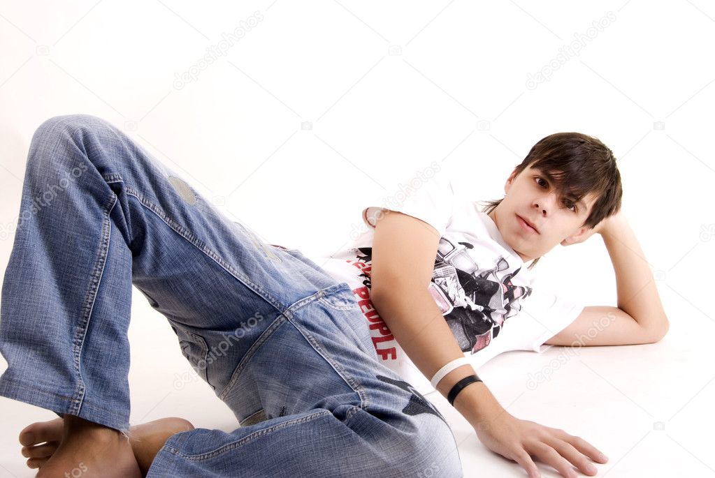 Young guy lying — Stock Photo © HASLOO #4219675 Young guy lying — Stock Photo © HASLOO #4219675